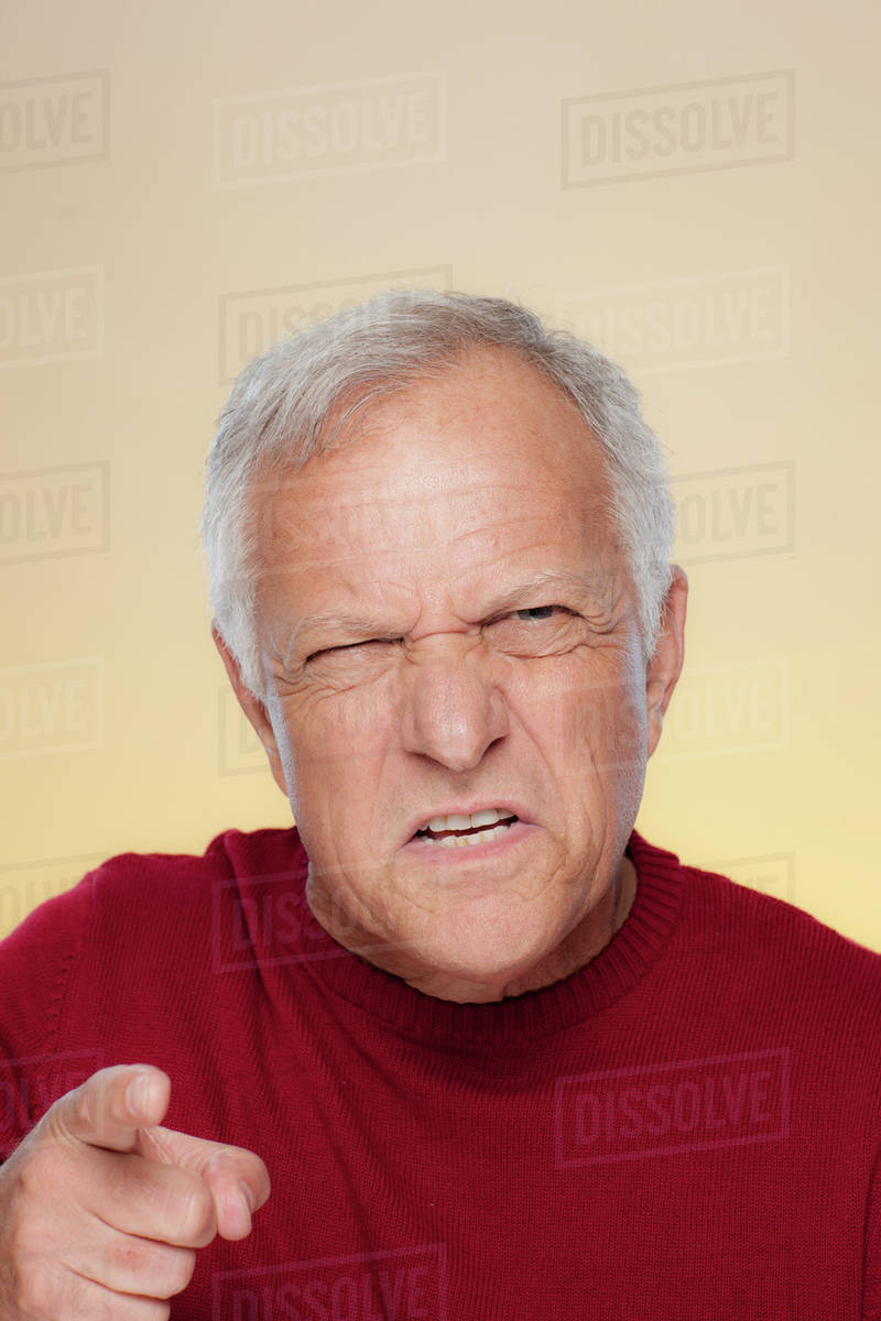 Studio shot of angry senior man - Royalty-free Stock Photo | Dissolve