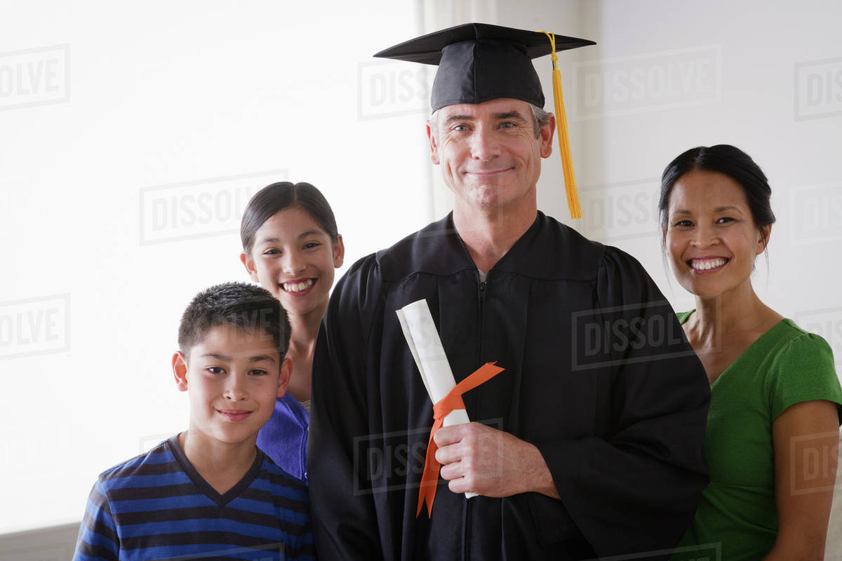 Family celebrating father's graduation - Royalty-free Stock Photo ...