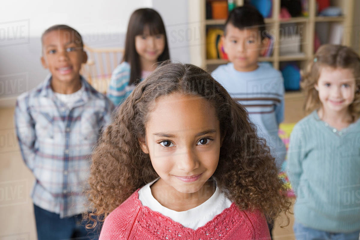 Smiling children (6-7) in classroom - Royalty-free Stock Photo | Dissolve