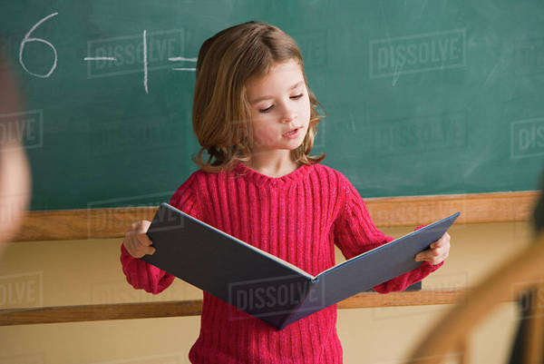 Girl (6-7) having presentation in classroom - Royalty-free Stock Photo ...