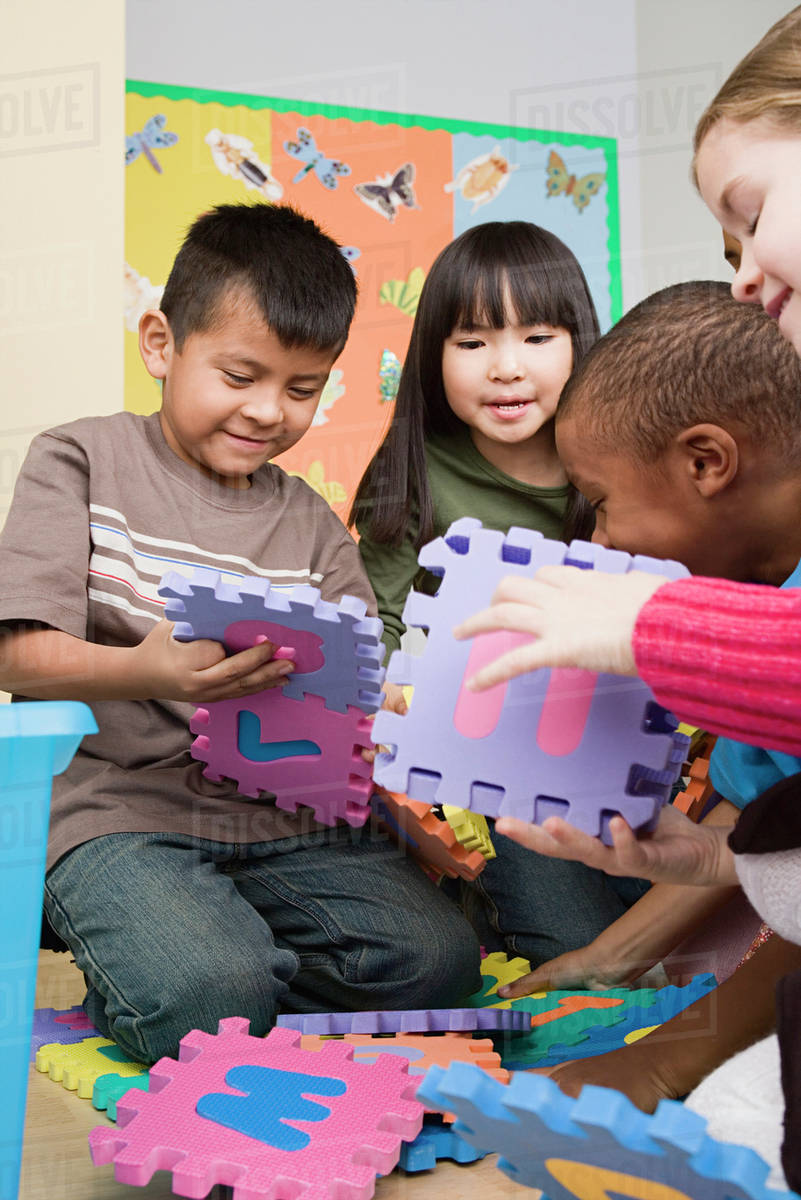 Children (6-7) learning in classroom - Royalty-free Stock Photo | Dissolve