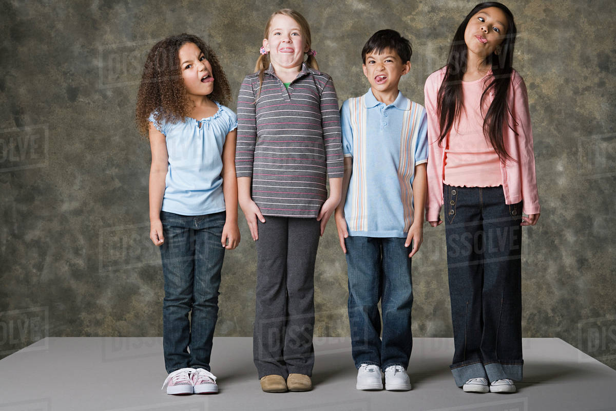 Children (8-9) making faces, studio shot - Royalty-free Stock Photo ...