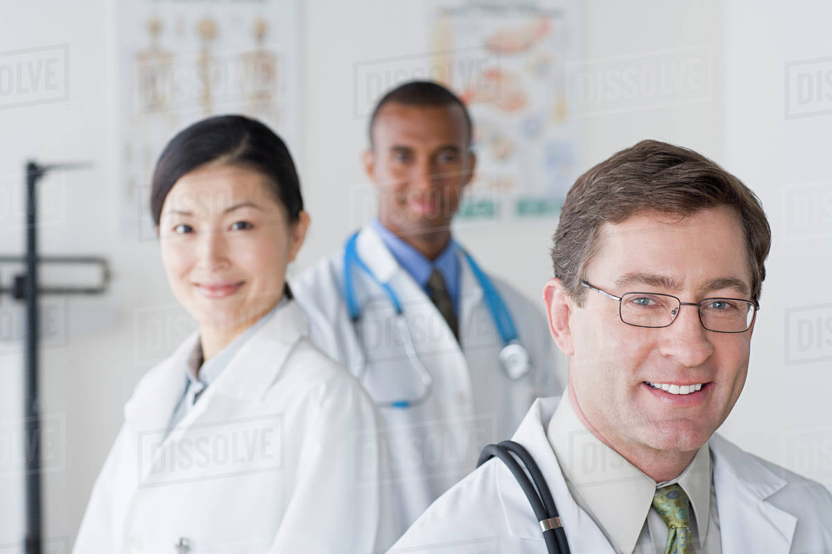 Group portrait of smiling doctors - Stock Photo - Dissolve