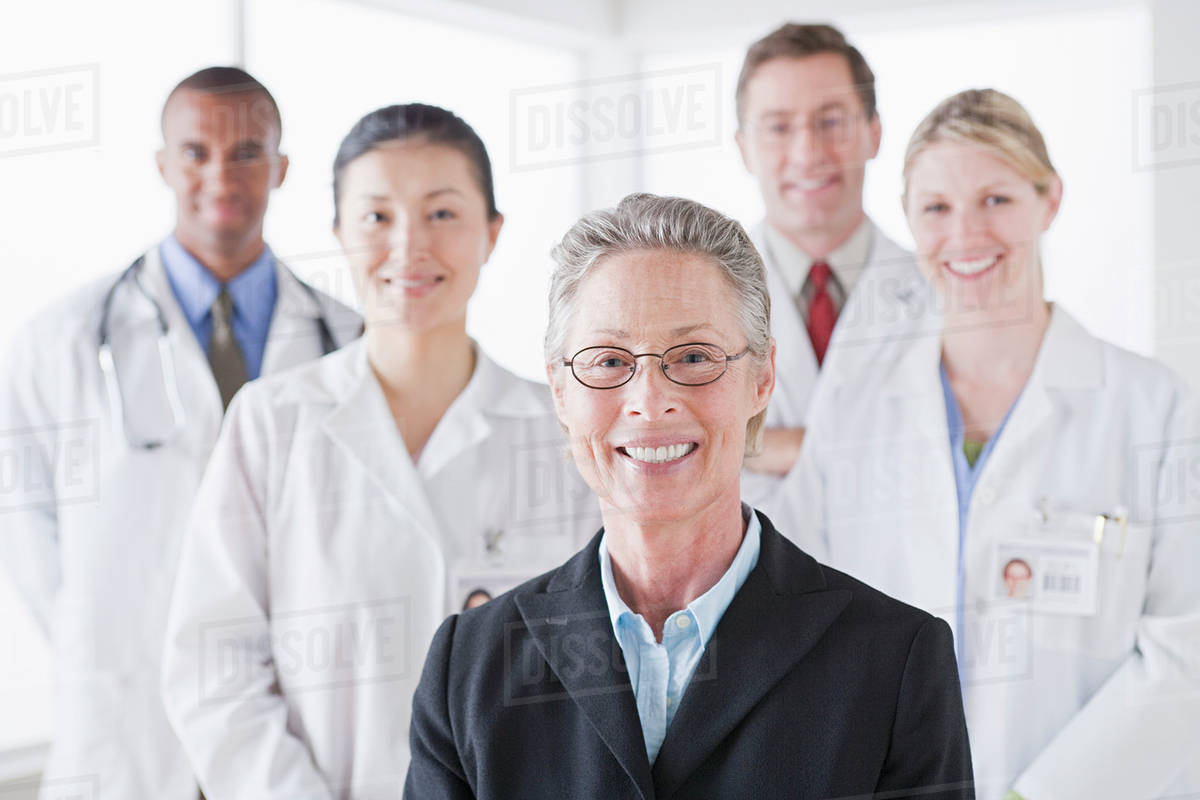 Group portrait of smiling doctors - Royalty-free Stock Photo | Dissolve