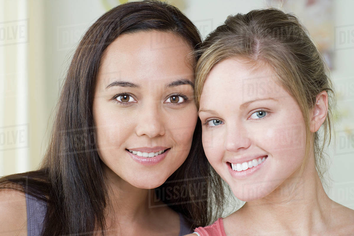 Portrait of two attractive women - Stock Photo - Dissolve