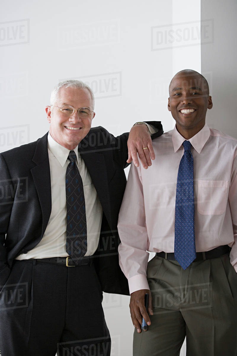 Two businessmen smiling - Royalty-free Stock Photo | Dissolve