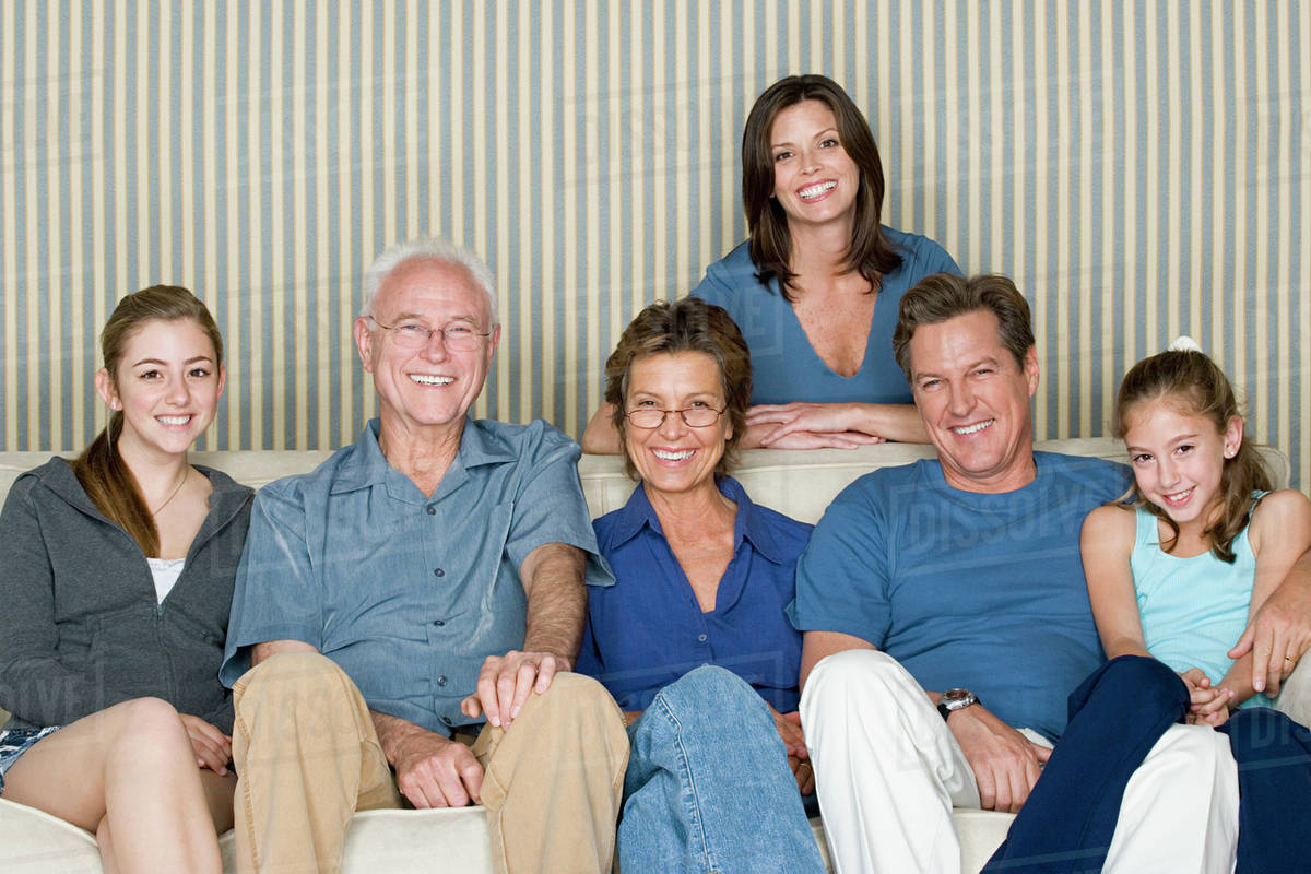 Portrait of two generation family with two girls (8-9, 14-15) sitting ...