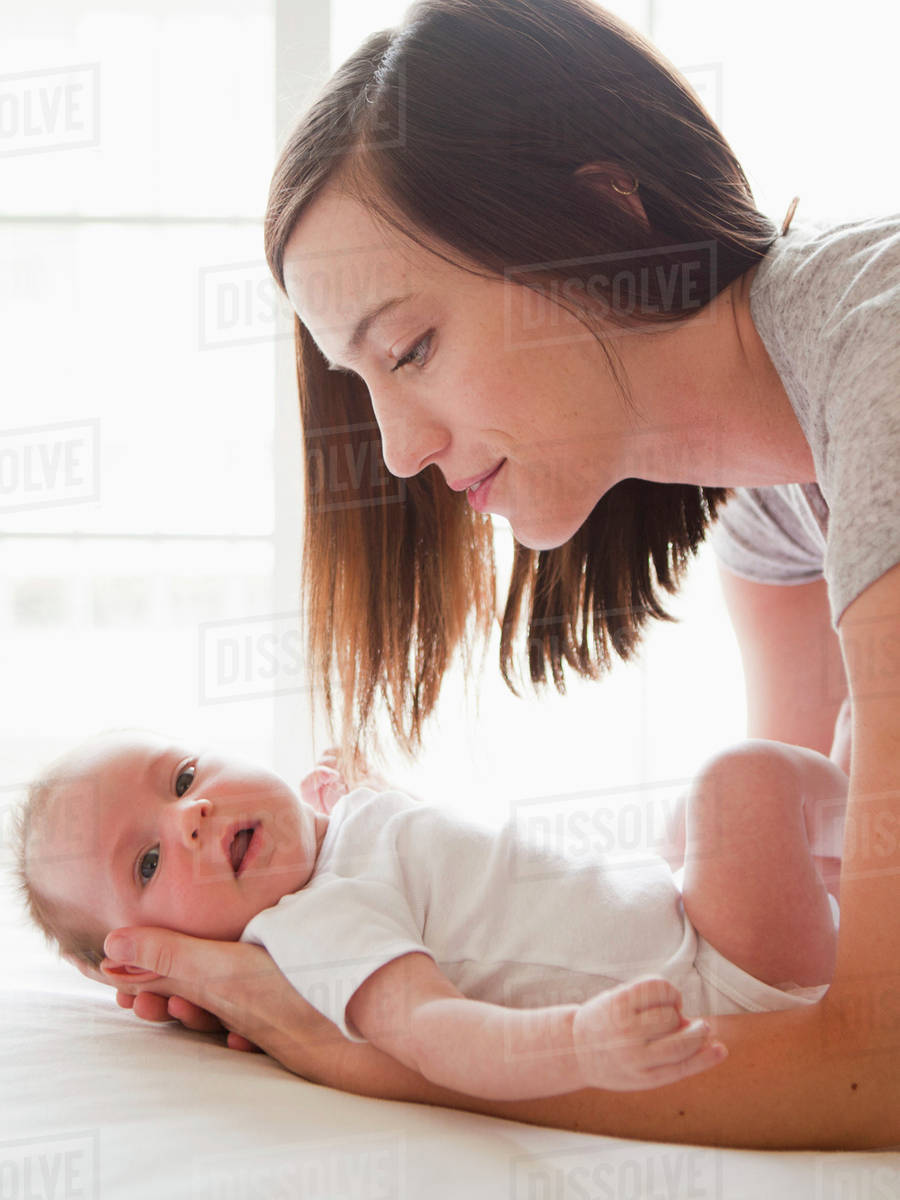 Mother changing baby girl (2-5 months) - Royalty-free Stock Photo ...