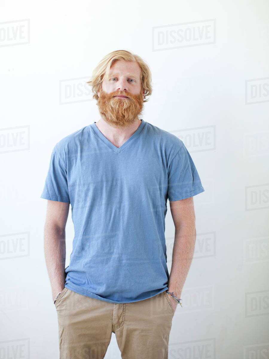 Studio portrait of man with beard - Stock Photo - Dissolve