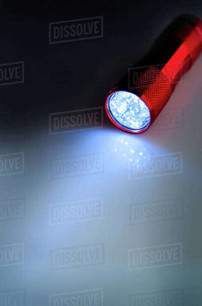 Illuminated flashlight - Royalty-free Stock Photo | Dissolve