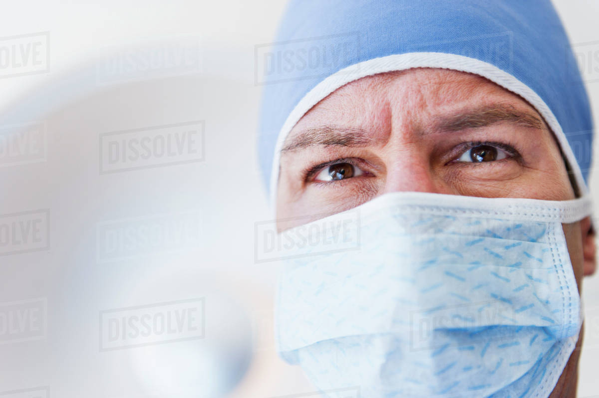 Male surgeon wearing surgical mask - Royalty-free Stock Photo | Dissolve