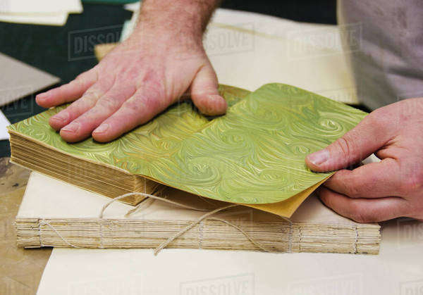 Hands binding book - Stock Photo - Dissolve