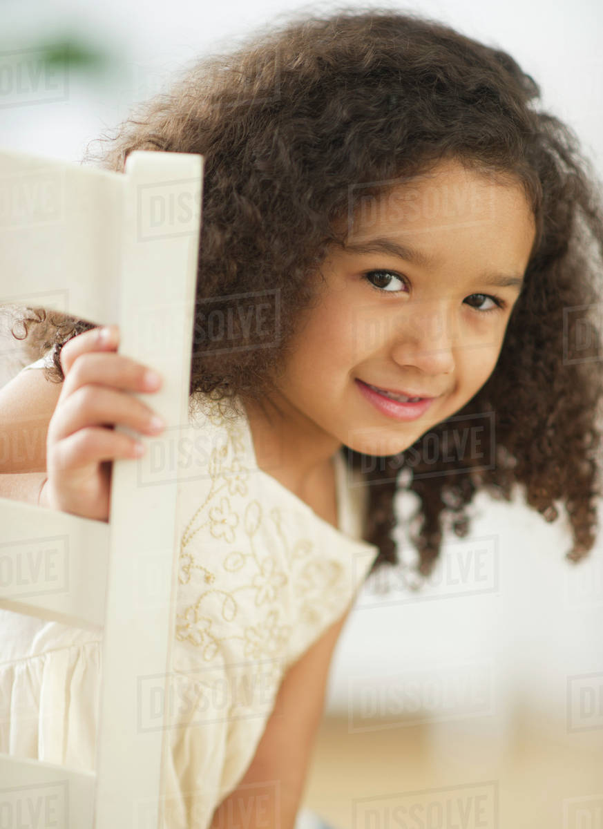 USA, New Jersey, Jersey City, portrait of smiling girl (6-7) with afro ...