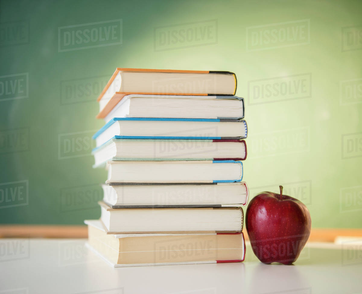 Studio Shot of books stacked and apple next to it - Royalty-free Stock ...