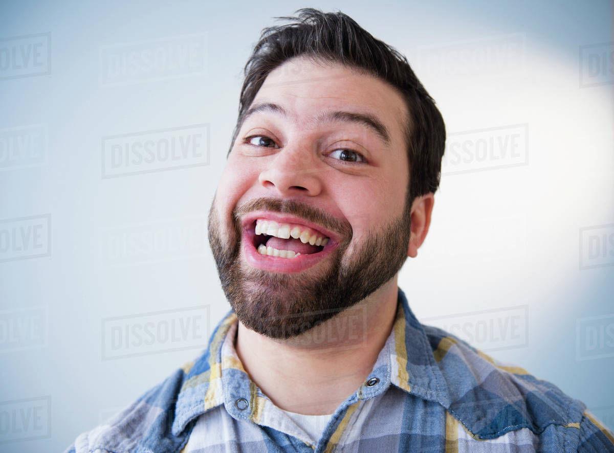 Portrait of happy man, laughing - Stock Photo - Dissolve