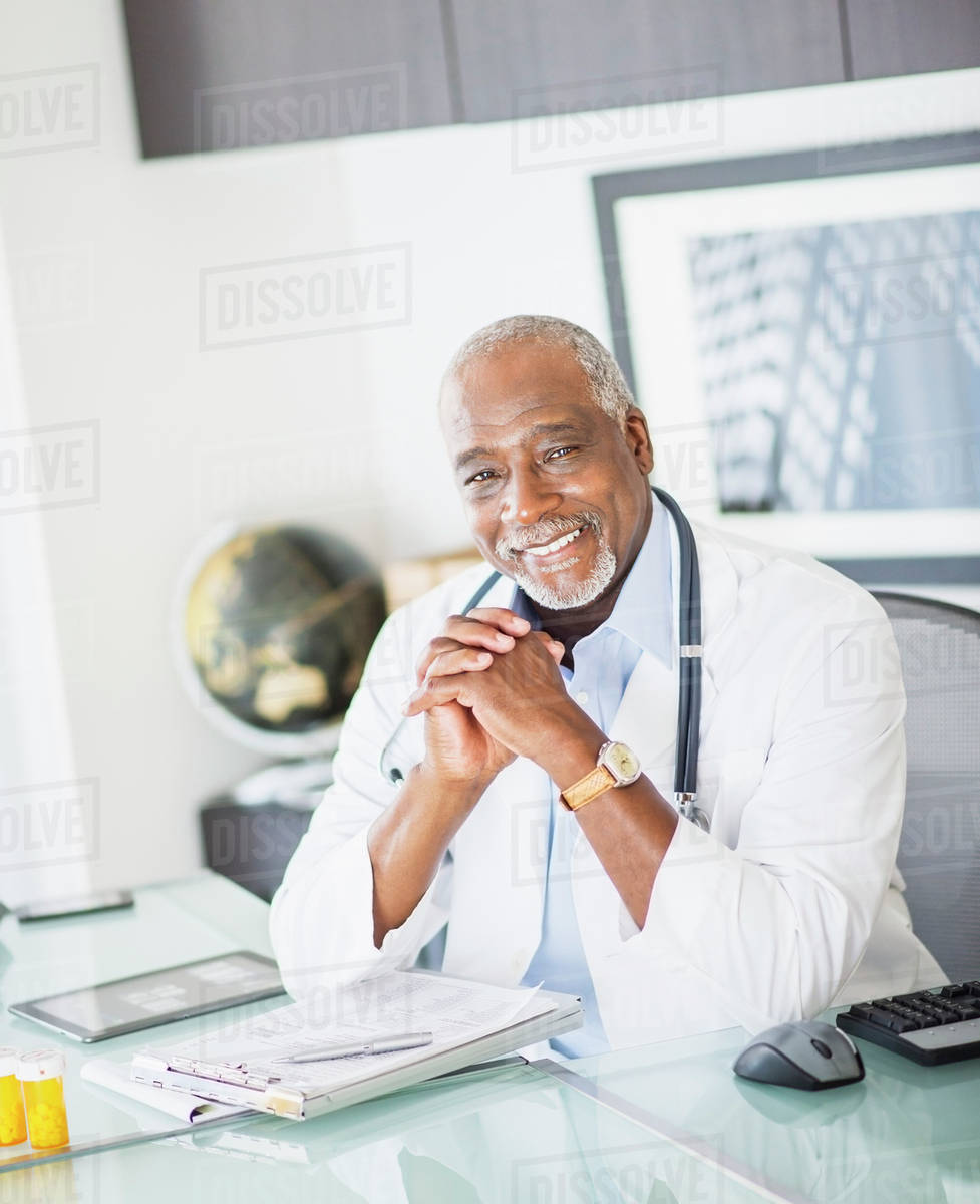 Portrait of doctor in office - Royalty-free Stock Photo | Dissolve