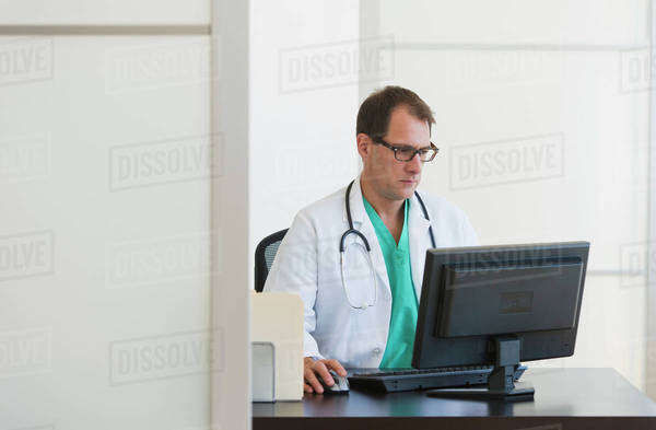 Doctor using computer - Royalty-free Stock Photo | Dissolve