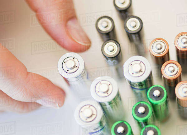 Hand holding batteries - Royalty-free Stock Photo | Dissolve