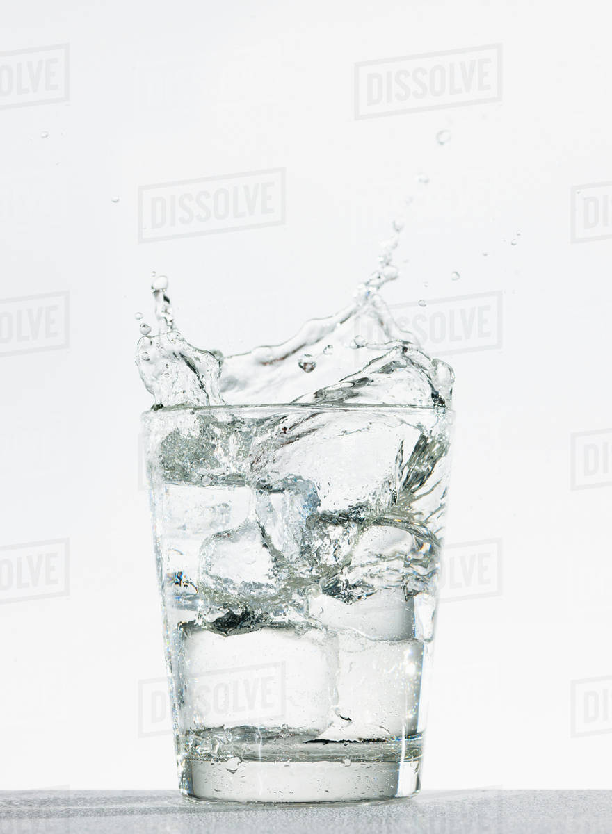Studio shot of glass of water with splash - Royalty-free Stock Photo ...