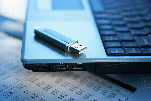 Studio shot of laptop with memory stick - Royalty-free Stock Photo ...
