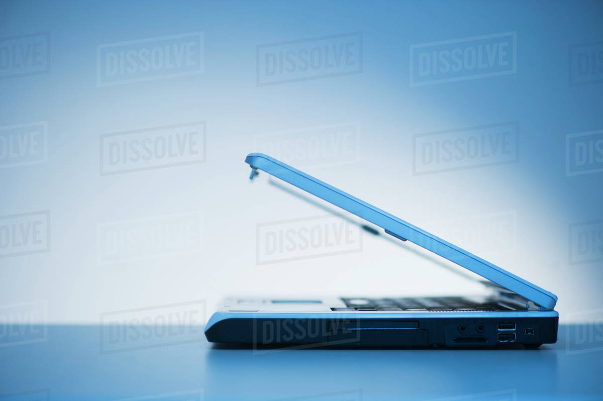 Studio shot of closed laptop - Stock Photo - Dissolve