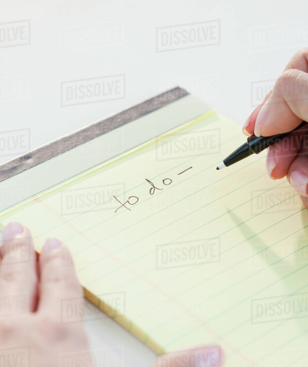 Close up of woman's hands writing list of things to do - Royalty-free ...