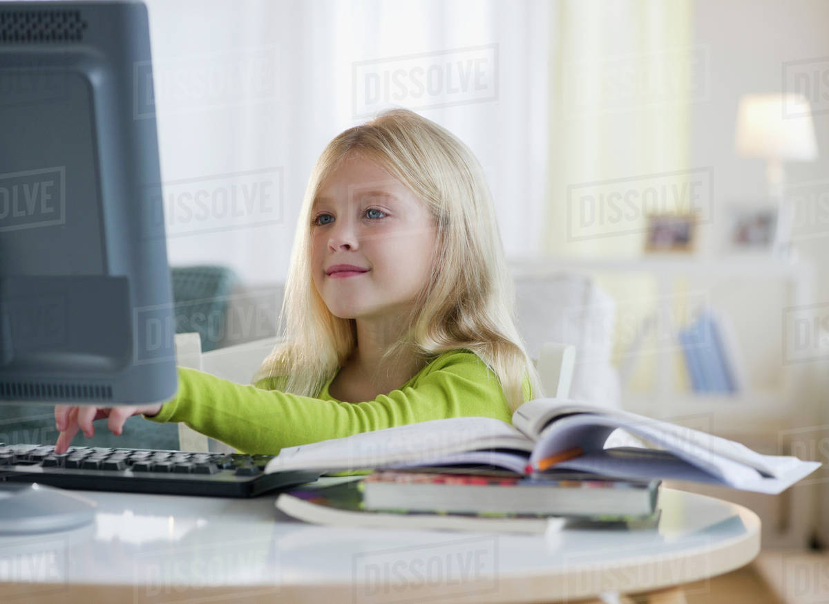 USA, New Jersey, Jersey City, Girl (8-9) sitting in front of computer ...