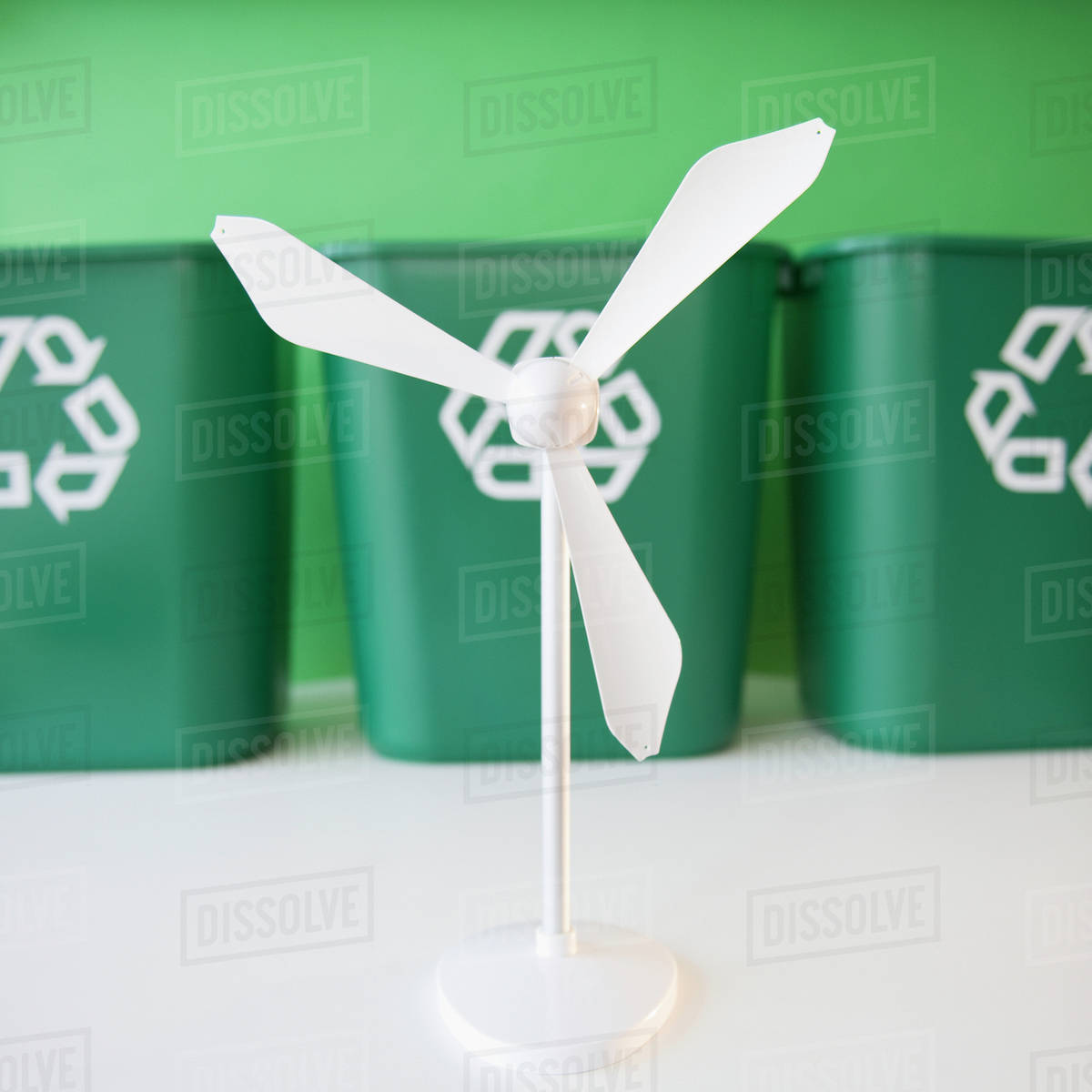 Close up of model of wind turbine and garbage bins - Royalty-free Stock ...