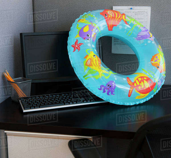 Close up of inflatable ring on office desk - Stock Photo - Dissolve