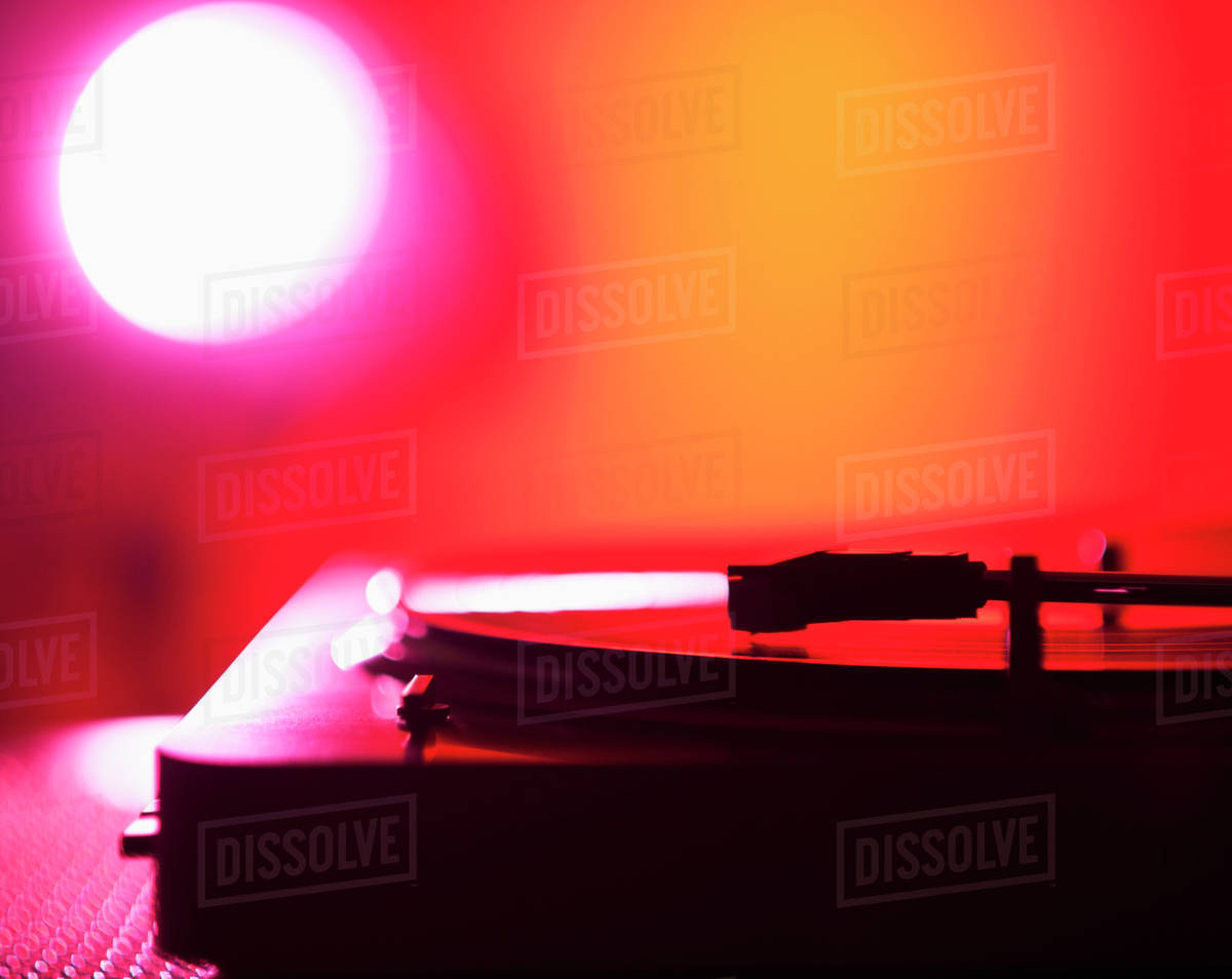 Close up of turntable on colored background - Stock Photo - Dissolve