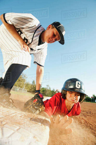 Boys (10-11) playing baseball - Royalty-free Stock Photo | Dissolve