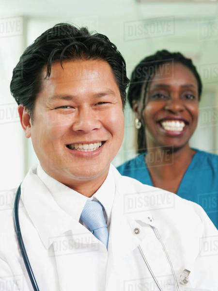 Doctor and nurse posing for portrait - Royalty-free Stock Photo | Dissolve