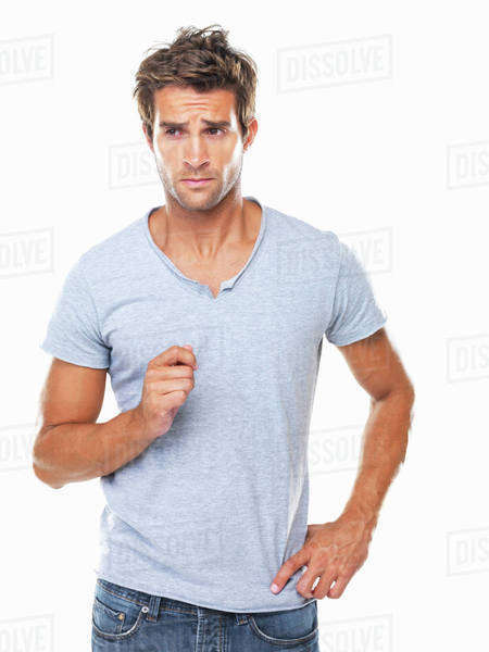 Studio shot of young man with furrowed forehead looking away - Royalty ...