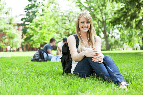 Portrait of female student on campus - Stock Photo - Dissolve