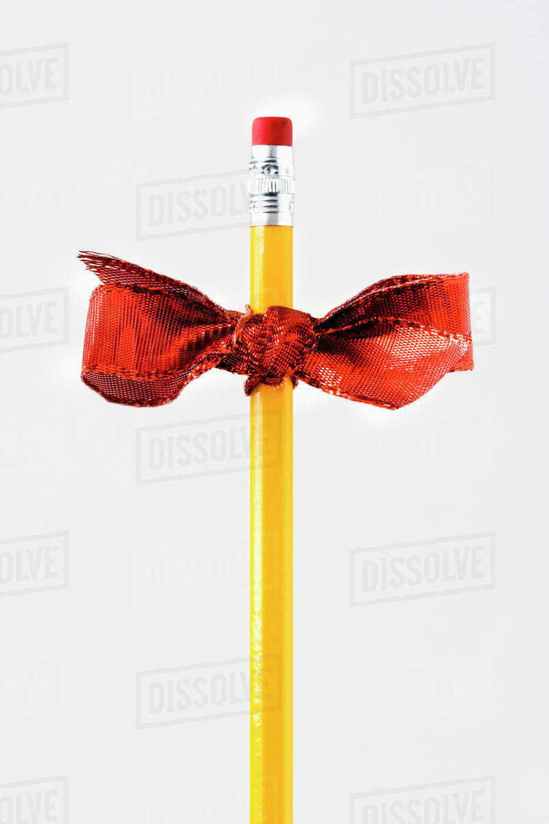 Studio shot of pencil with ribbon - Royalty-free Stock Photo | Dissolve