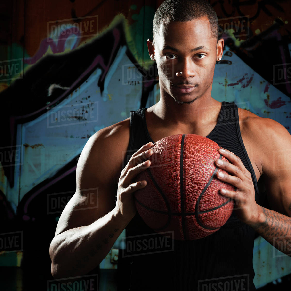 USA, Utah, Salt Lake City, Portrait of young man with basketball ...