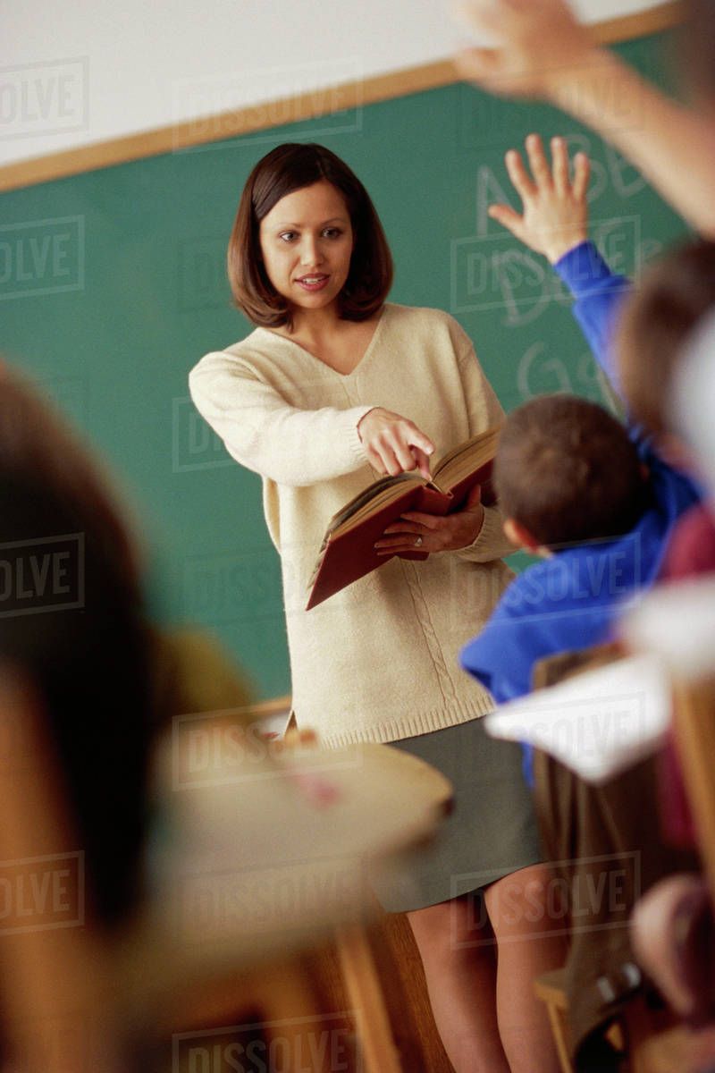 Teacher calling on student in classroom - Royalty-free Stock Photo ...