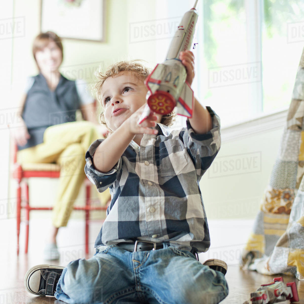 USA, Utah, Boy (2-3) playing on floor - Stock Photo - Dissolve