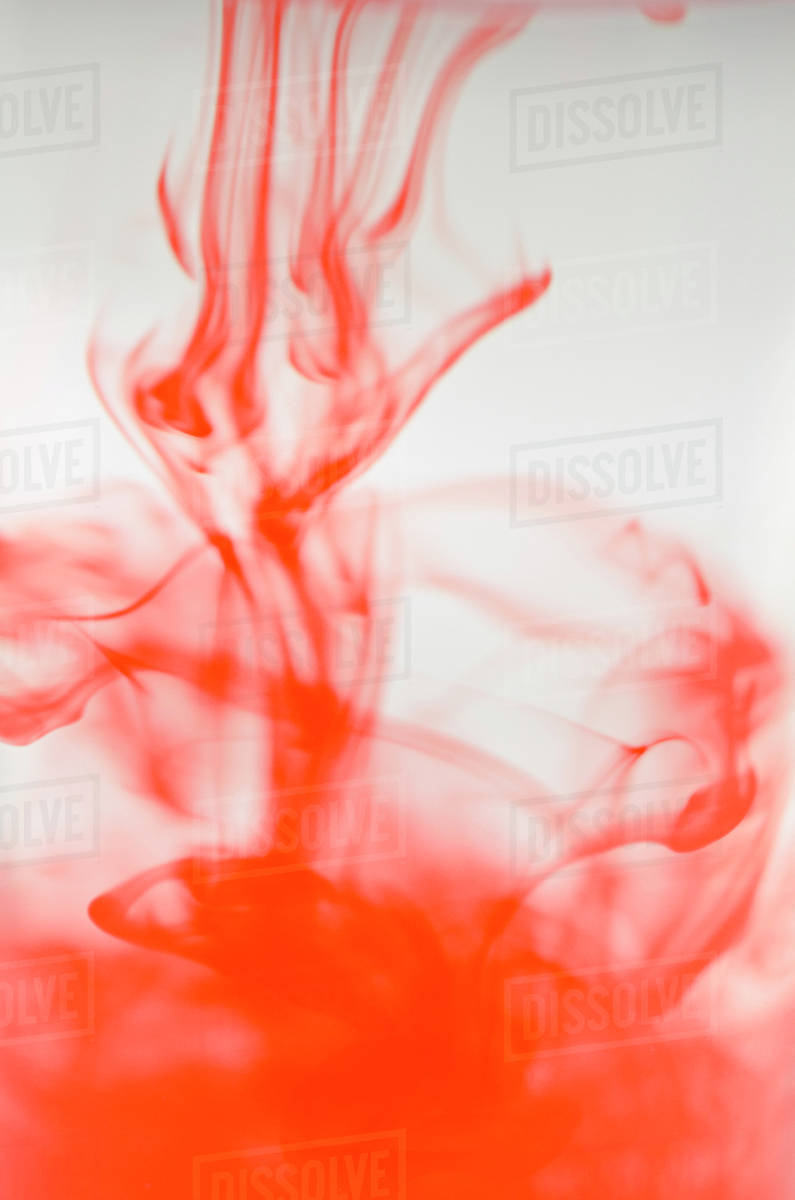 Studio shot of red liquid dissolving in water - Royalty-free Stock ...