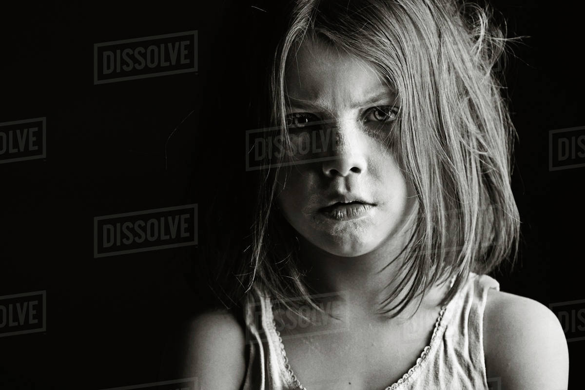 Studio portrait of serious girl (6-7) - Royalty-free Stock Photo | Dissolve