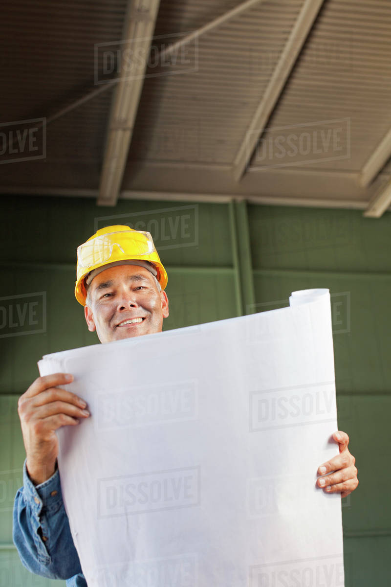 Portrait of architect holding blueprint - Royalty-free Stock Photo ...