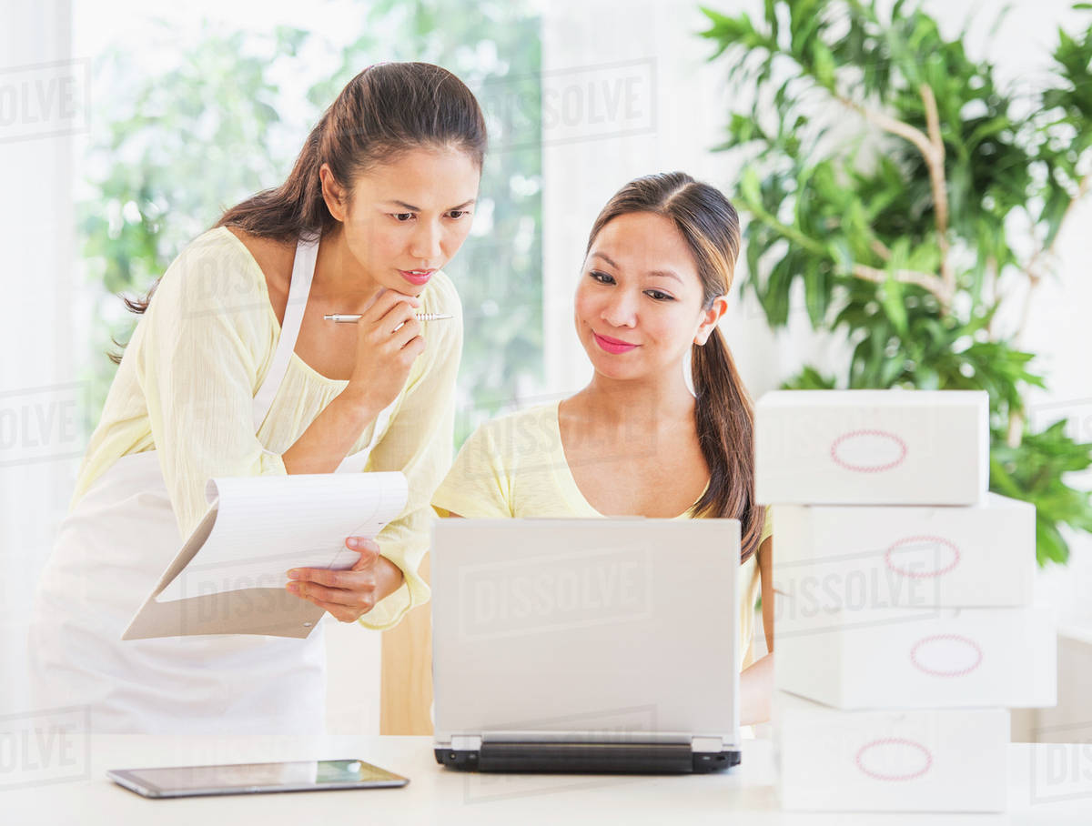 Two women working - Royalty-free Stock Photo | Dissolve