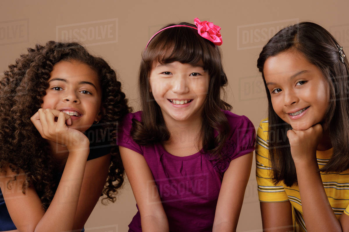 Studio portrait of three girls (10-11) - Royalty-free Stock Photo ...