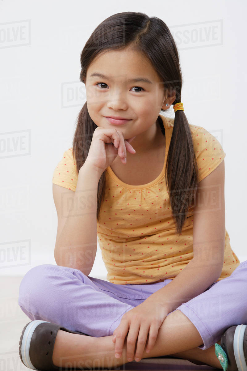 Studio portrait of girl (8-9) - Royalty-free Stock Photo | Dissolve
