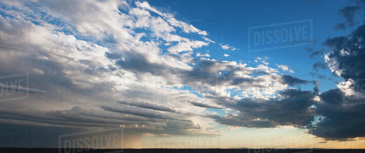 Cloudscape over field - Royalty-free Stock Photo | Dissolve