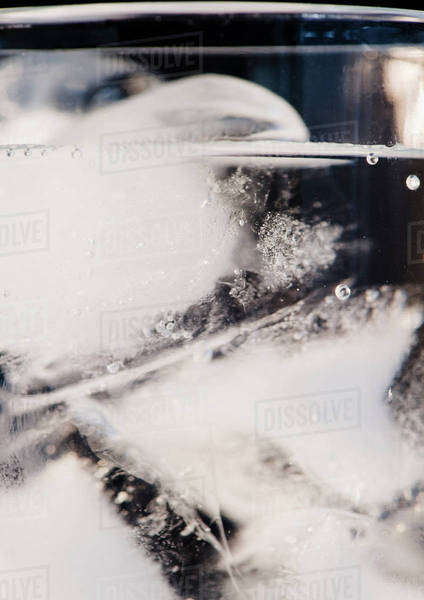 Glass of water and ice cubes - Royalty-free Stock Photo | Dissolve