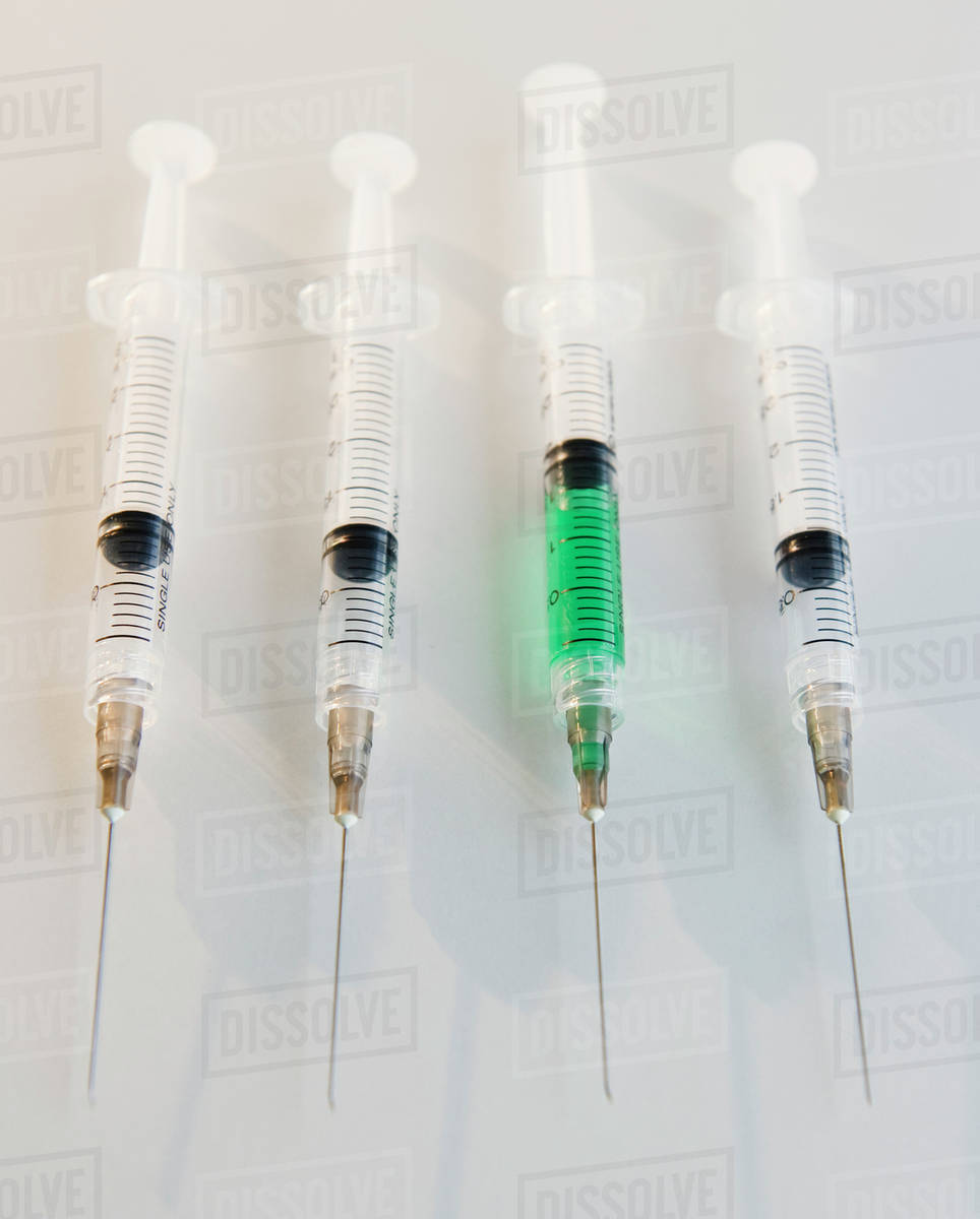 Four syringes - Royalty-free Stock Photo | Dissolve