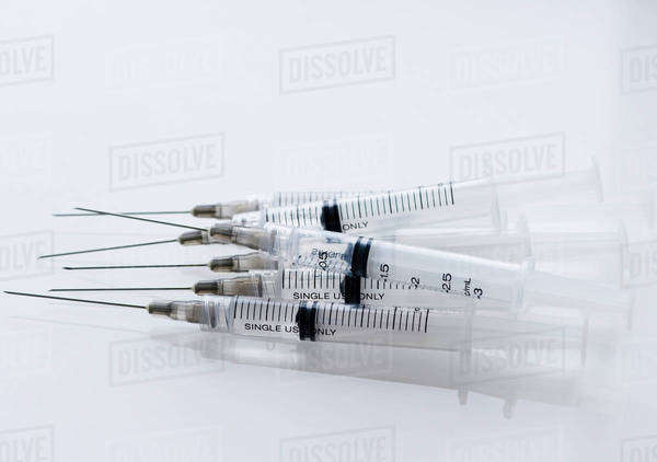 Pile of syringes - Stock Photo - Dissolve