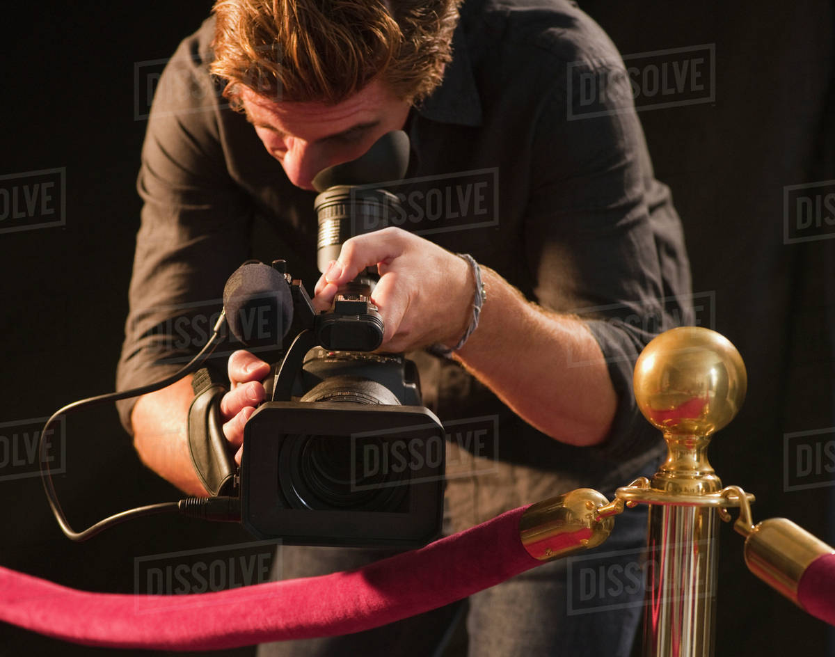 Cameraman at red carpet event - Stock Photo - Dissolve