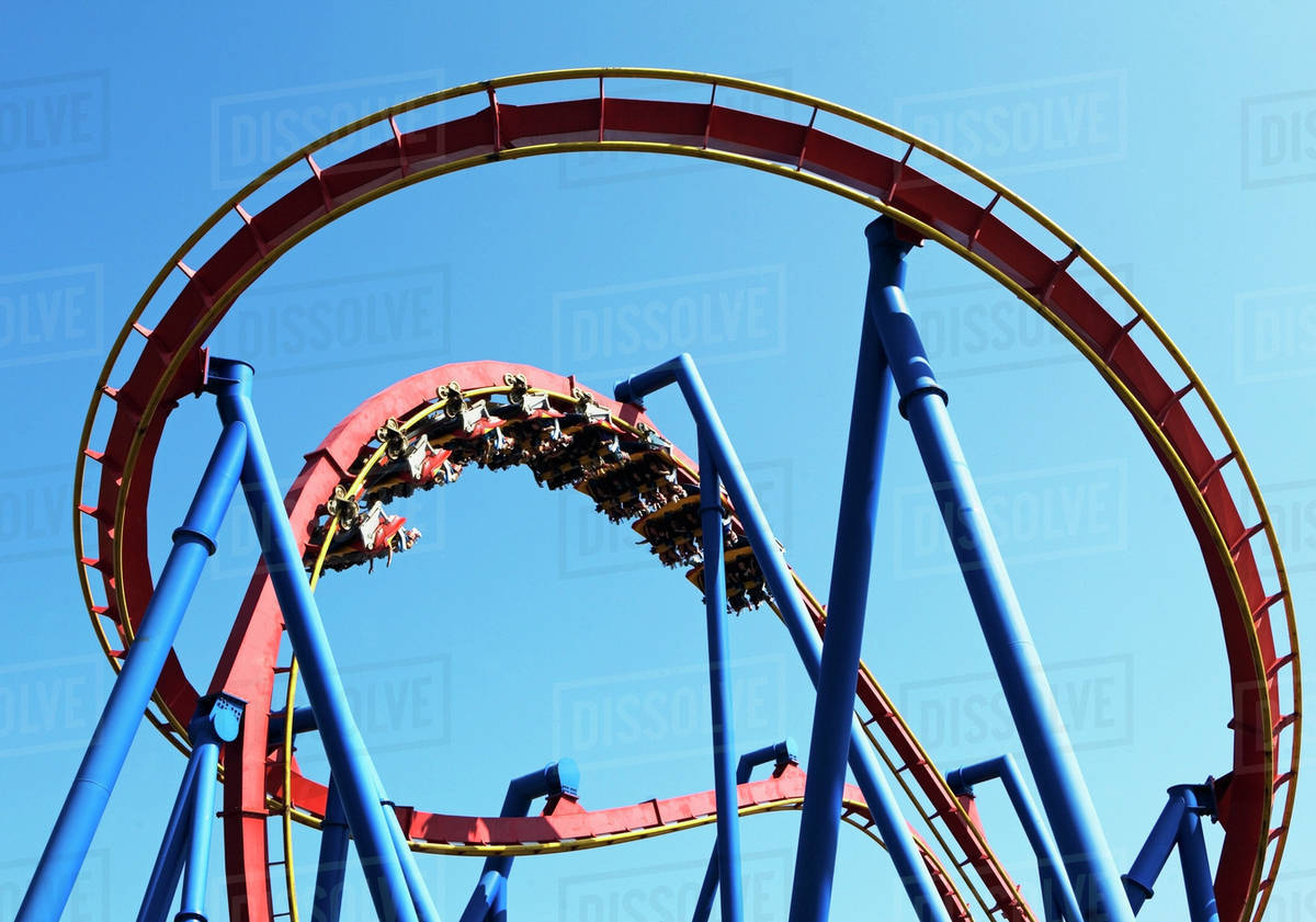 Rollercoaster against blue sky - Royalty-free Stock Photo | Dissolve